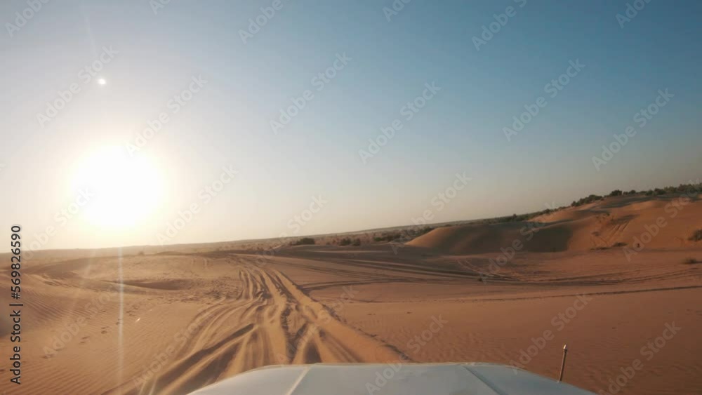 4K POV of a vehicle dune bashing on the sand dunes of the Thar desert at Jaisalmer in Rajasthan ...