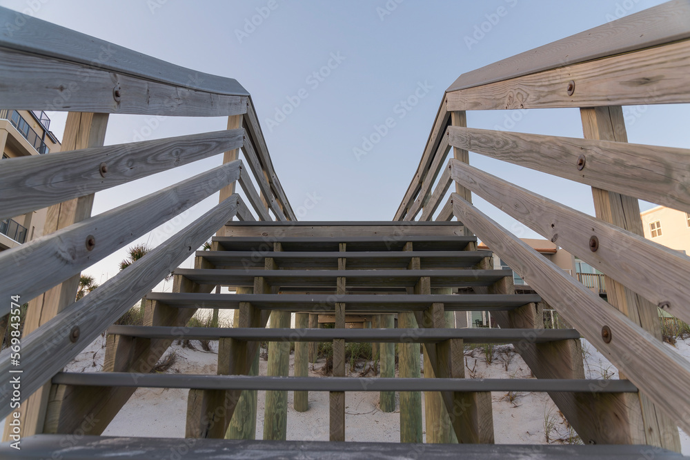 Open stairs with views of sand dunes with grasses at the background in ...