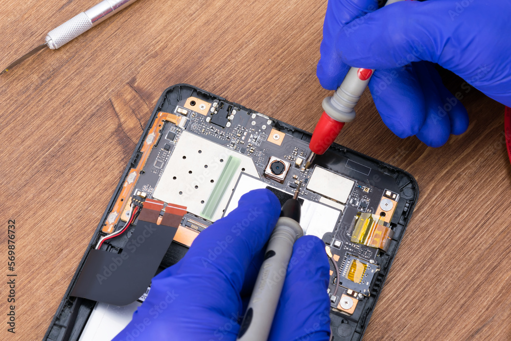 the process of repairing a mobile device and replacing faulty parts ...