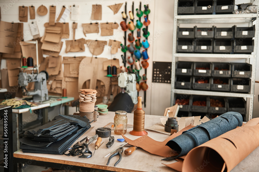Tools and material sitting on a leather studio workbench Stock Photo ...