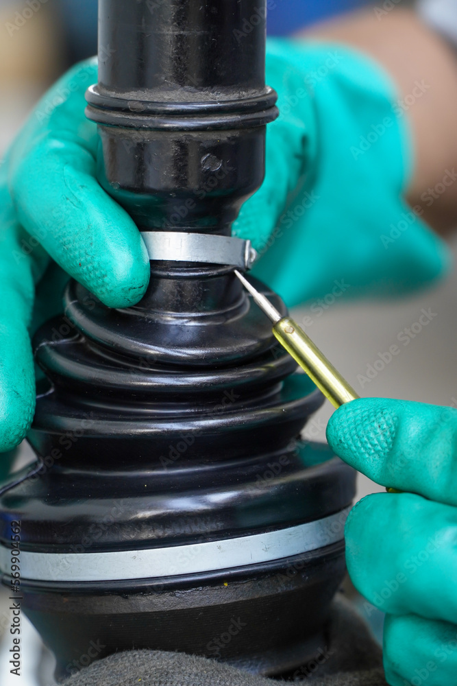 driveshaft mechanic inspects and repairs.macpherson suspension ...