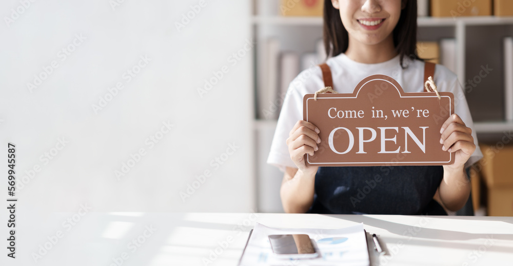 Small Business Owner, Young Asian Woman Turned on an open sign standing ...