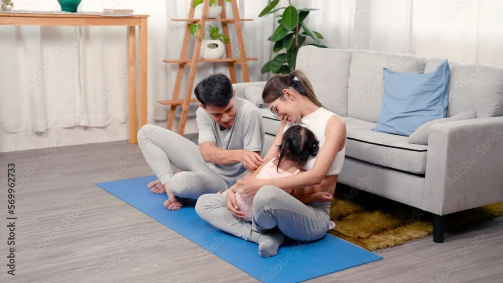 4K, Parent child sitting together on carpet in living room, beautiful ...