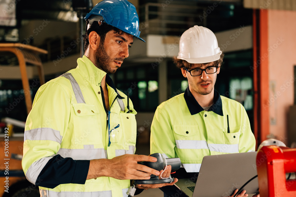 technicians workers with safety uniform using laptop talking and ...