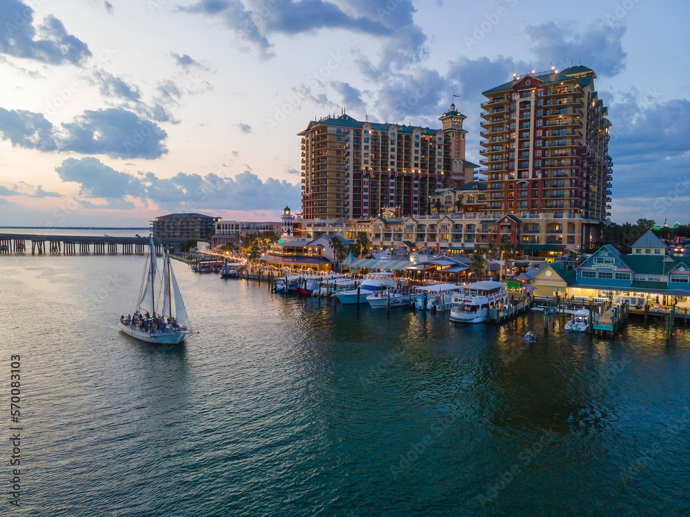 DESTIN HARBOR BOARDWALK, FLORIDA - CIRCA JUNE, 2022: Coastal hotel and ...