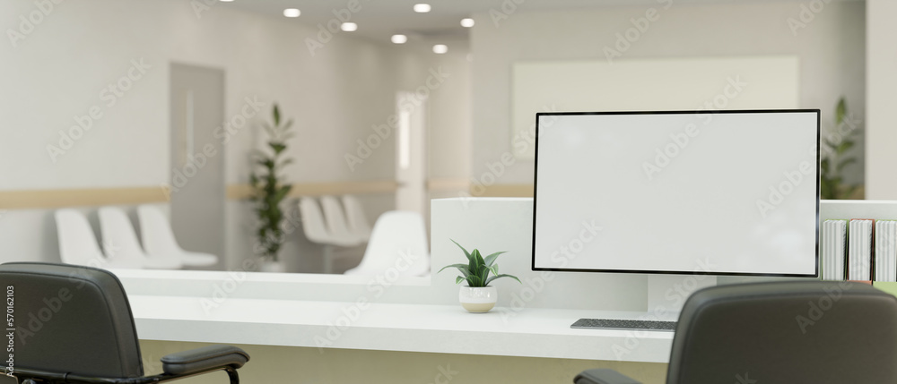 Modern white hospital reception or registration counter with computer ...