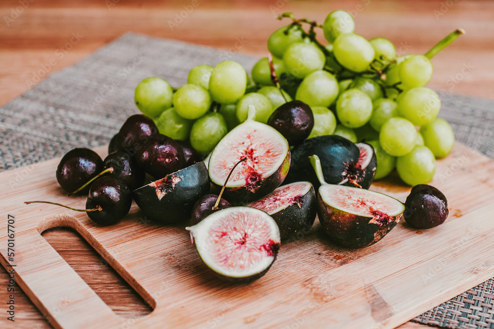 Grapes and figs on board, fresh fruit or Appetizers table in Mexico ...