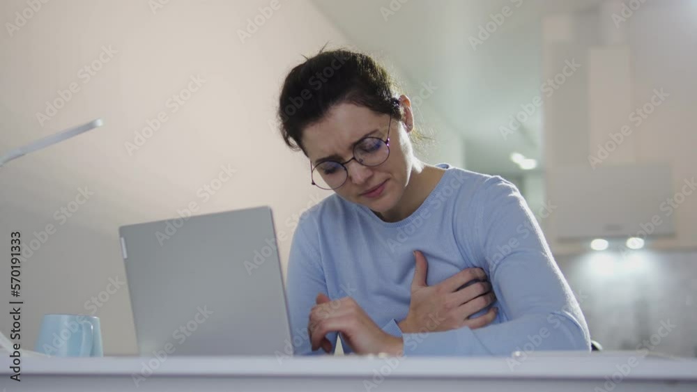Young concentrated on work woman feeling unpleasant pain in chest ...