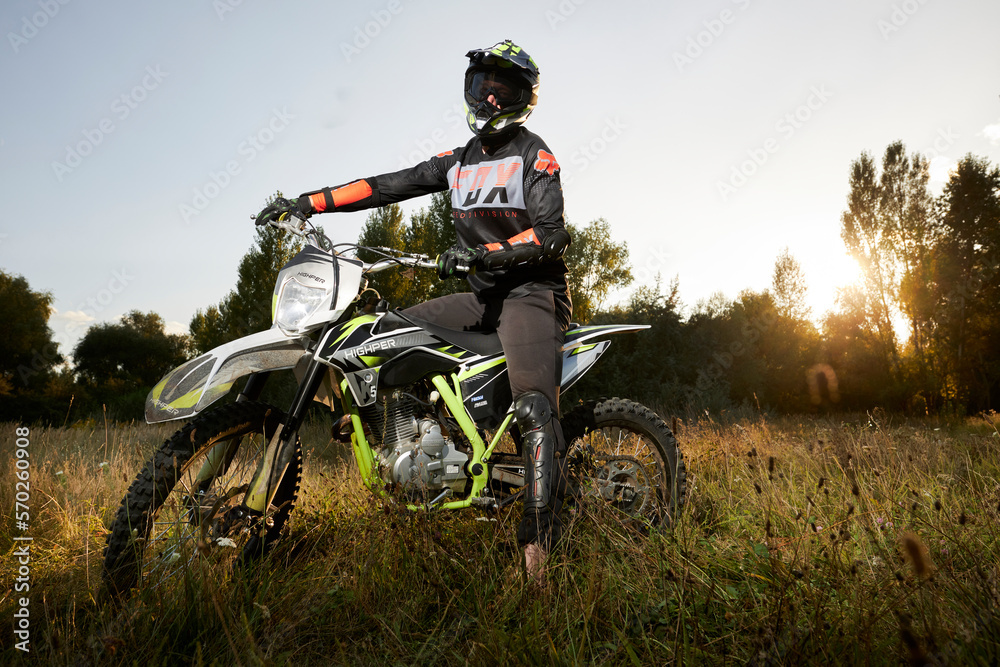 Enduro rider on an enduro motorcycle. Photo of an enduro rider. a ...
