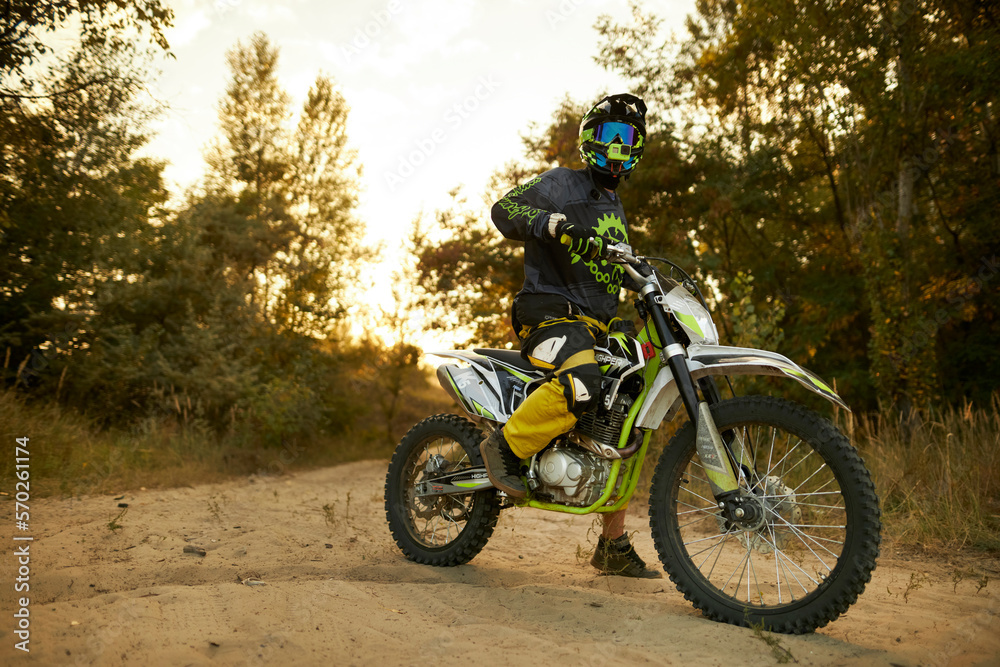 Enduro rider on an enduro motorcycle. Photo of an enduro rider. a ...