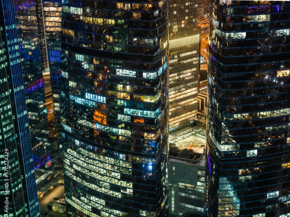 above view of glass towers in Moscow city business district in evening ...