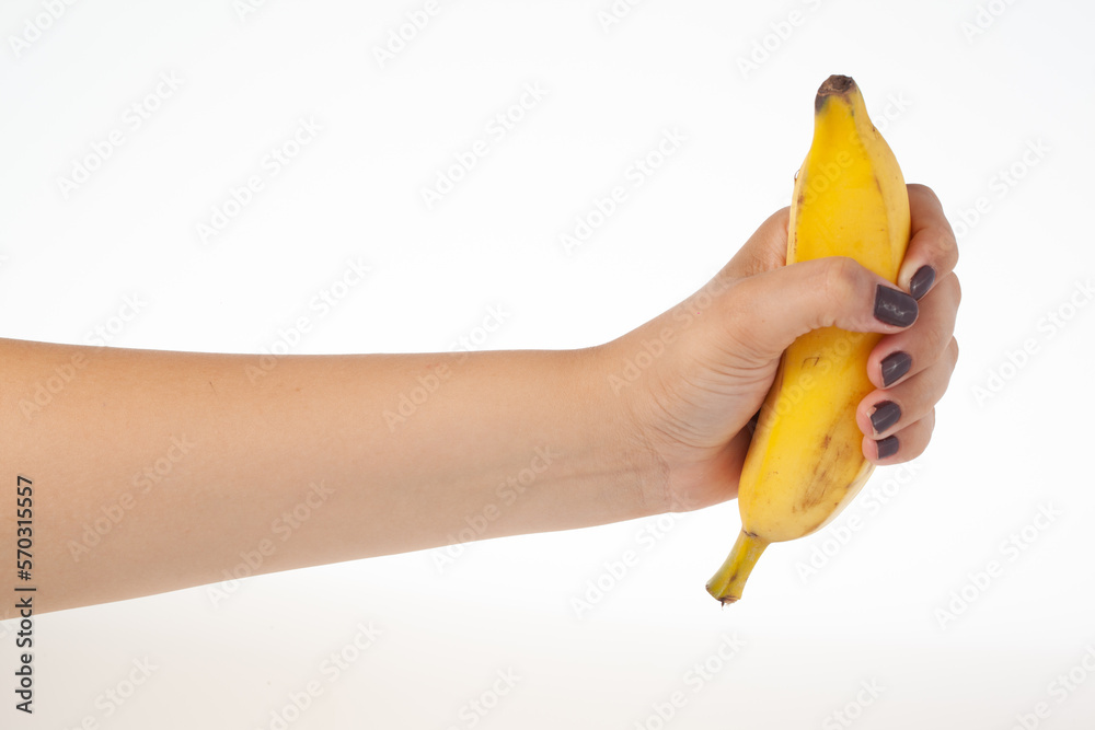 Hand holding whole banana isolated on white background Stock Photo ...