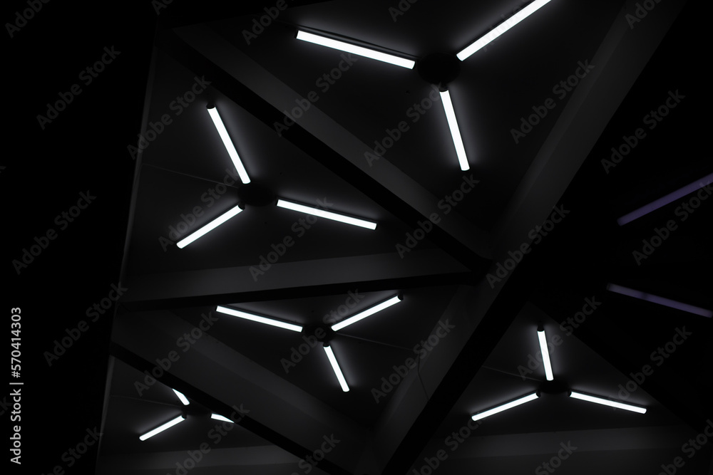 Triangular fluorescent lamps. Ceiling design. Interior details ...
