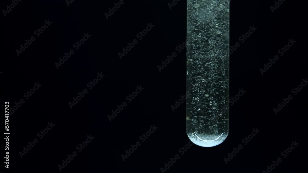 Stockvideon Reaction in water. Boiling and fizzing of ingredients in ...