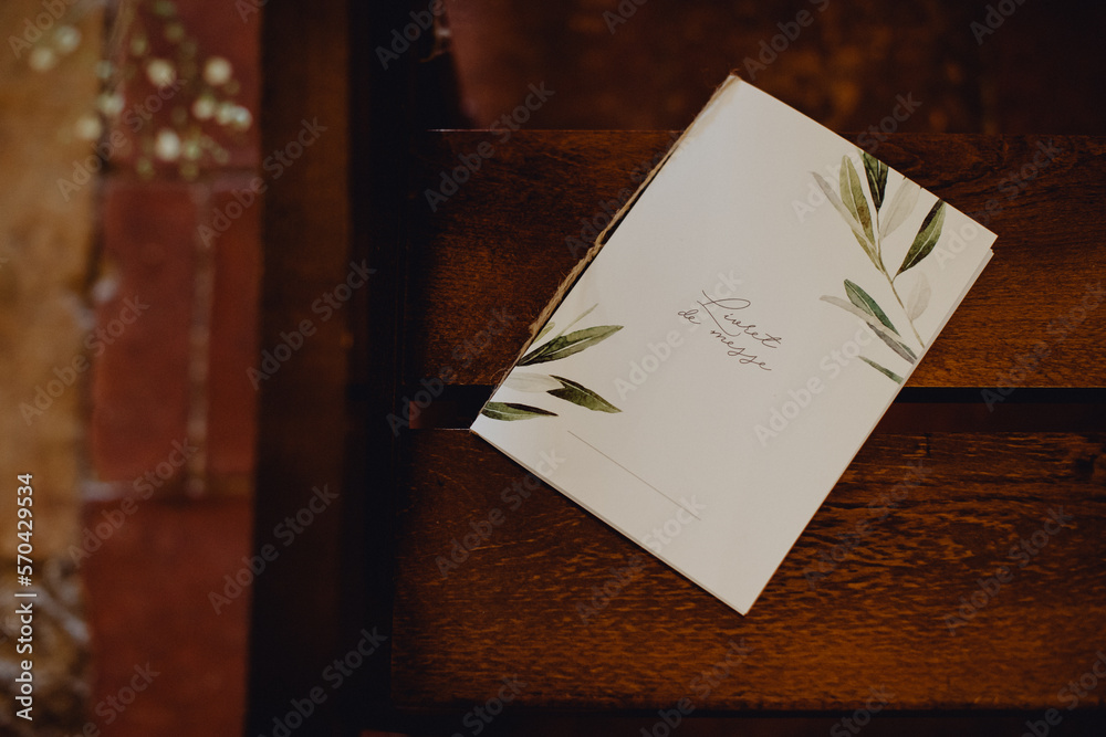 Livret de messe posé sur le banc de l'église Stock Photo | Adobe Stock