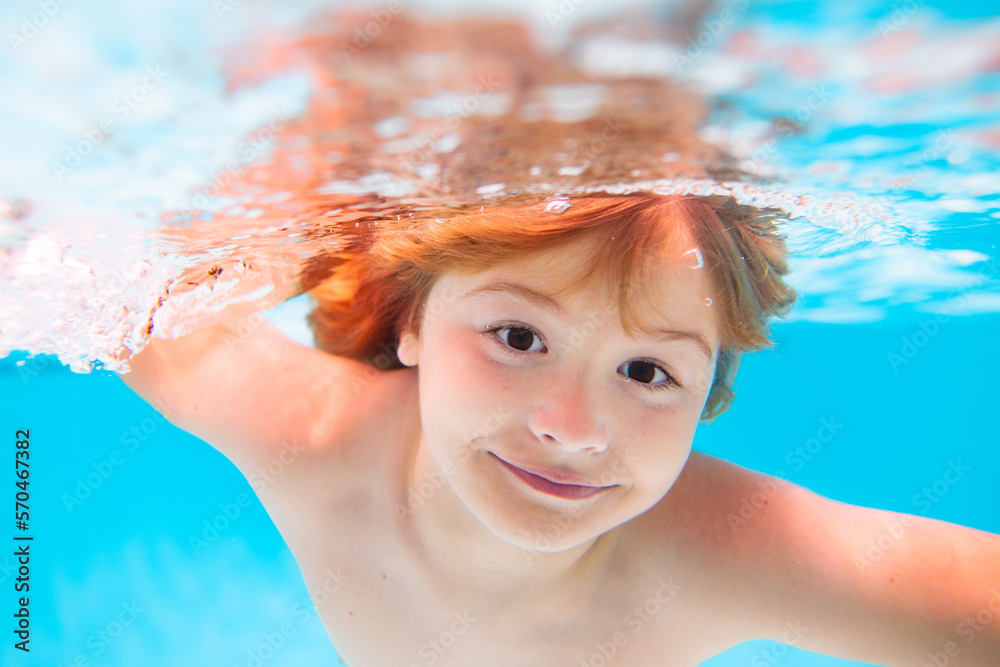 Child swim and dive underwater in the swimming pool. Kids swim on ...