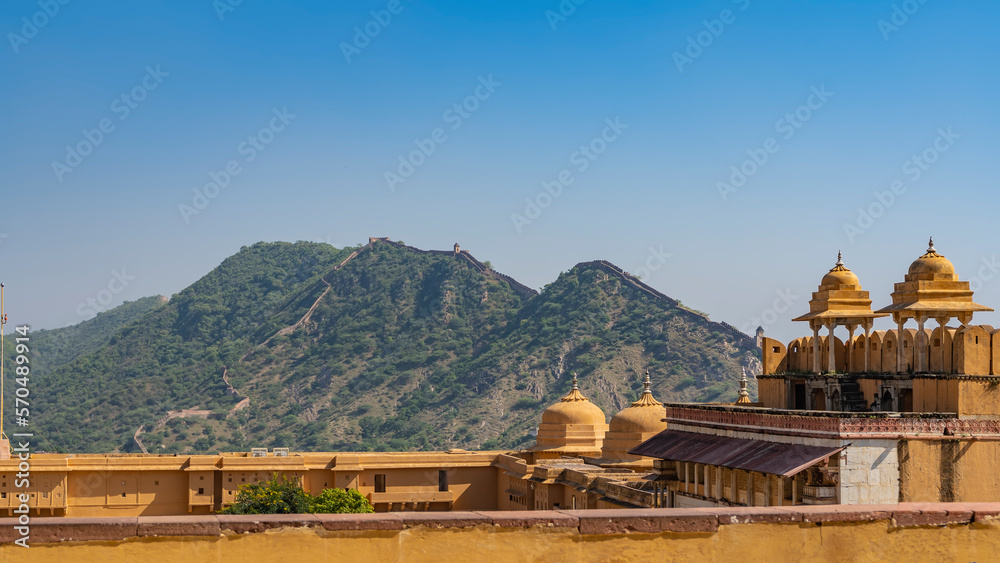 The ancient Amber Fort is built of orange sandstone. Domes and ...