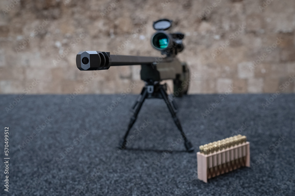American sniper rifle with a muzzle brake compesator, front view. Stock ...