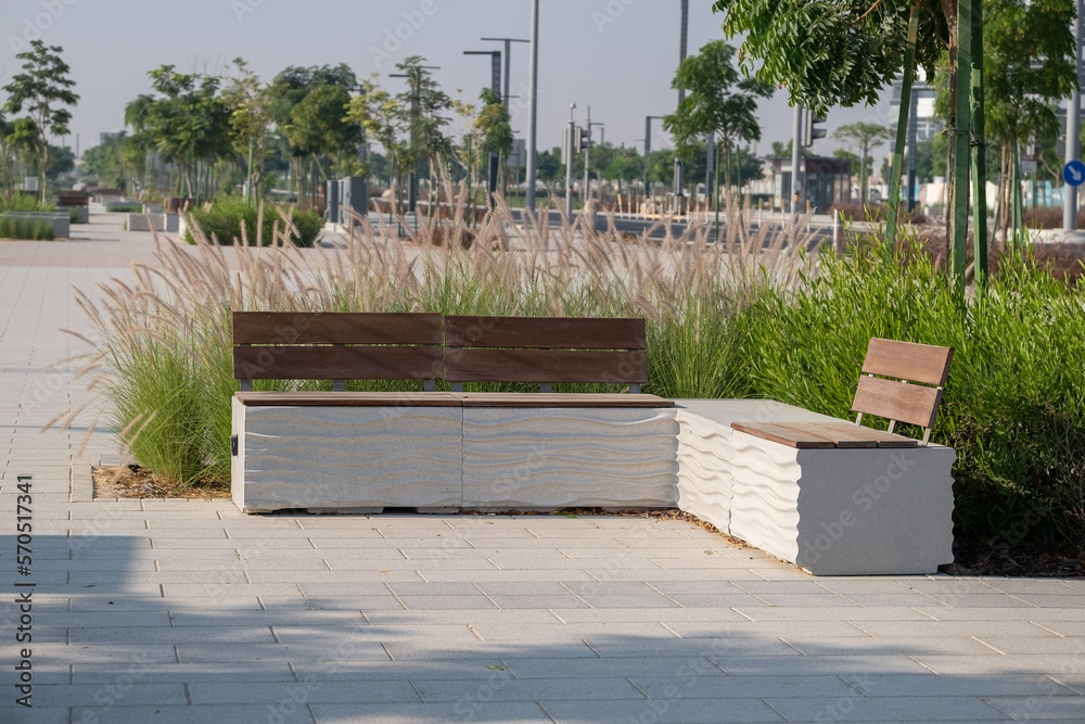 Stylish concrete benches in an empty park, a view of a modern square ...
