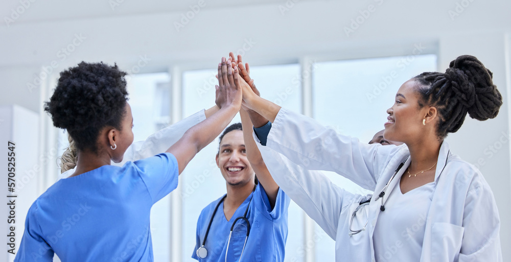 Success, high five and teamwork with doctors in hospital cheering for celebration, support or ...
