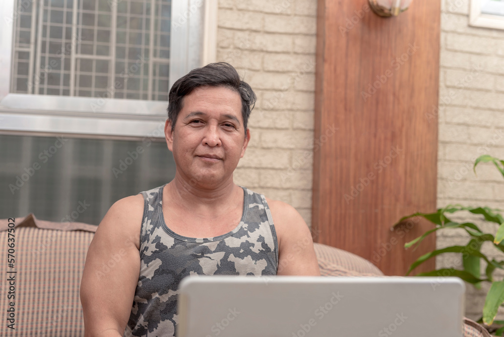 An asian guy in his early 50s with a great compact physique in a sando ...