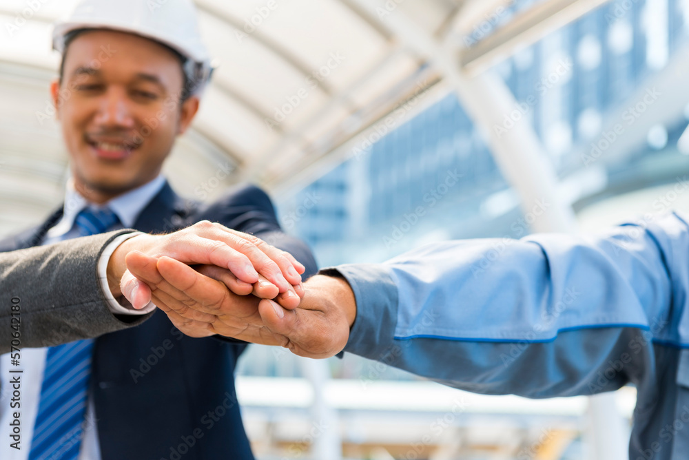 Group of Engineer United stack hands or join hand teamwork together ...