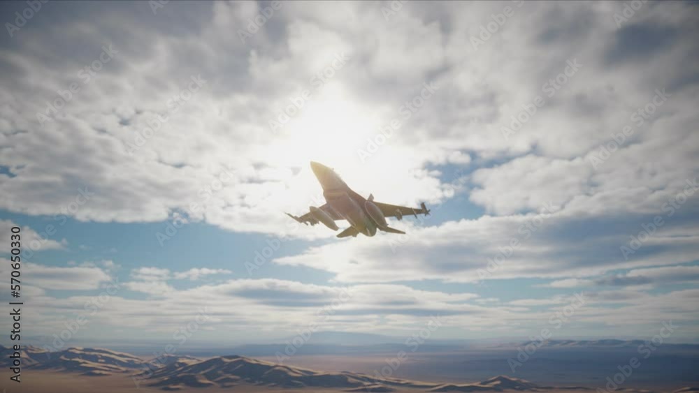 F-16 Falcon fighter jet flying over a desert landscape armed with bombs ...