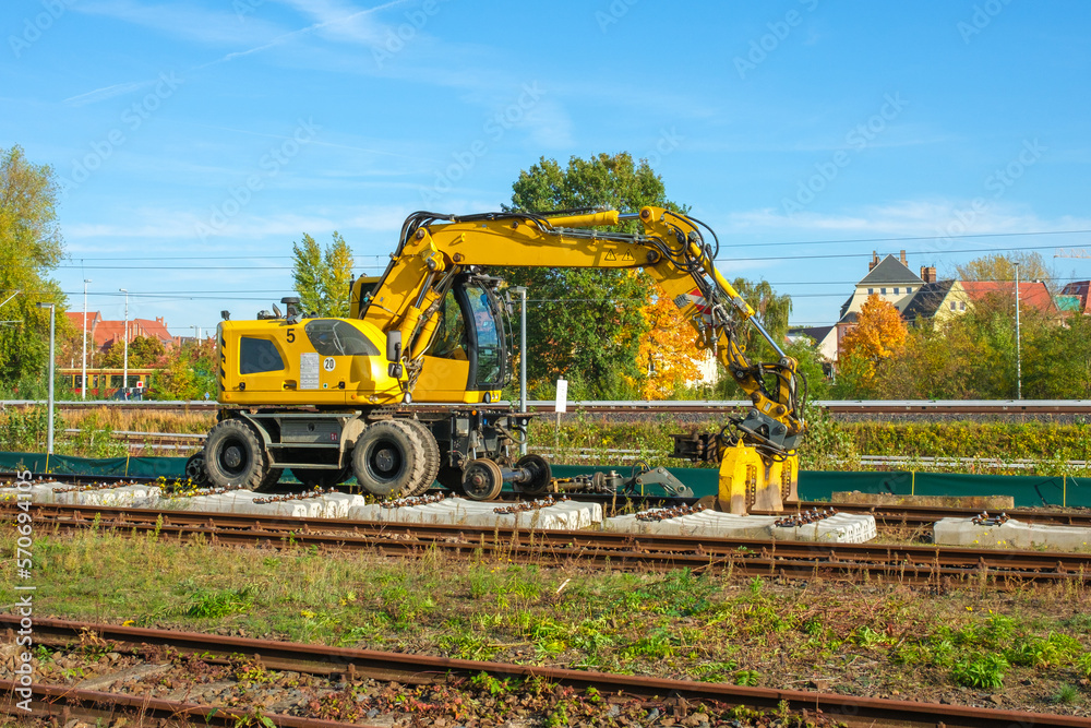 a Road-Rail Excavator on Train wheels at the construction site of rail ...