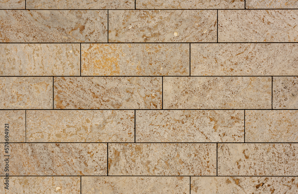 texture of a tiled beige stone wall as background Stock Photo | Adobe Stock