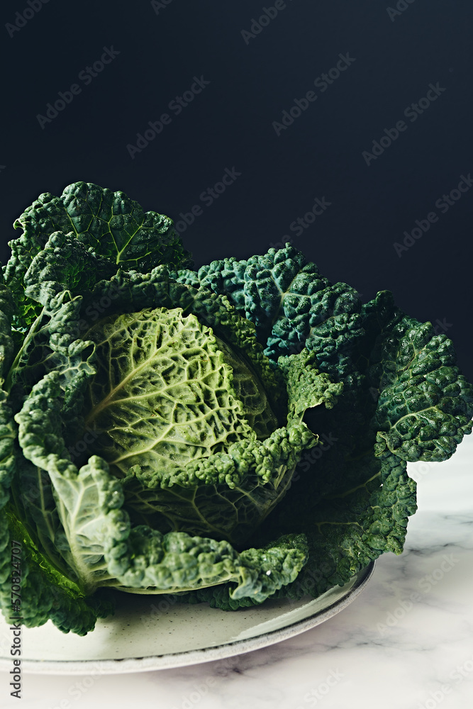Ripe leafy green savoy cabbage head on marble and dark background Stock ...