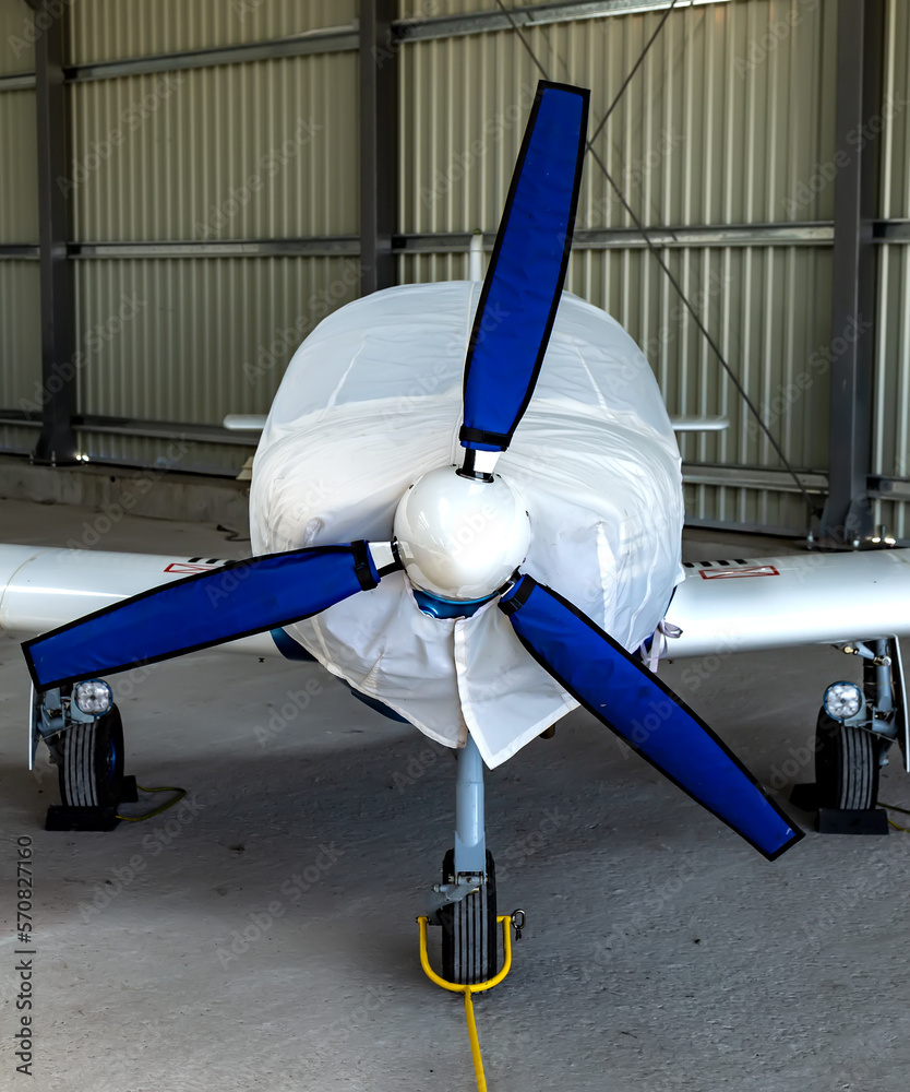 Turboprop plane covered engine and propeller closeup view against in ...