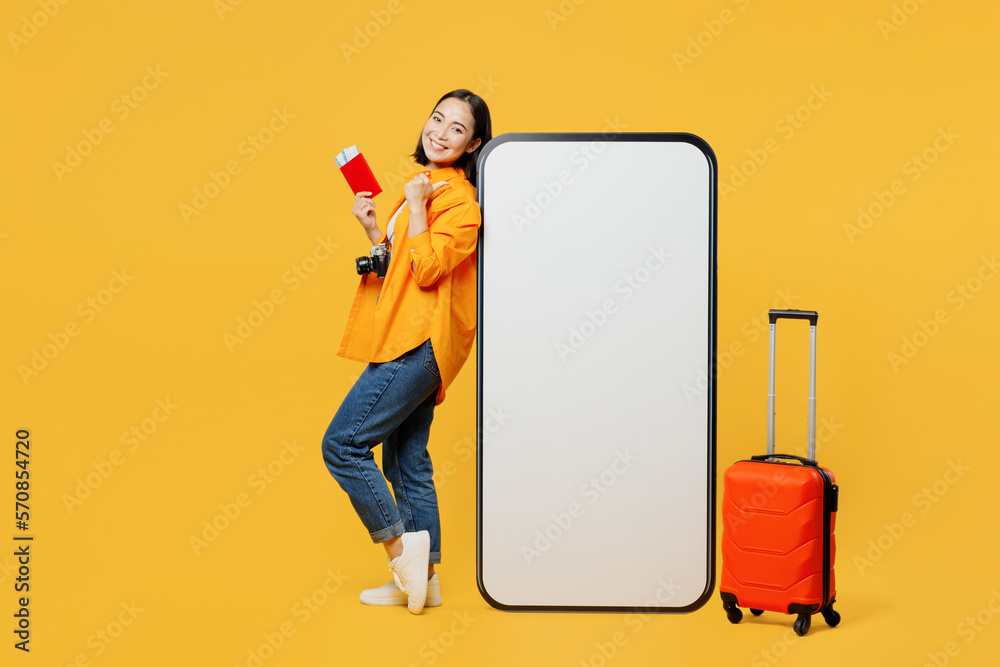 Young woman wear summer clothes stand near big huge blank screen mobile ...