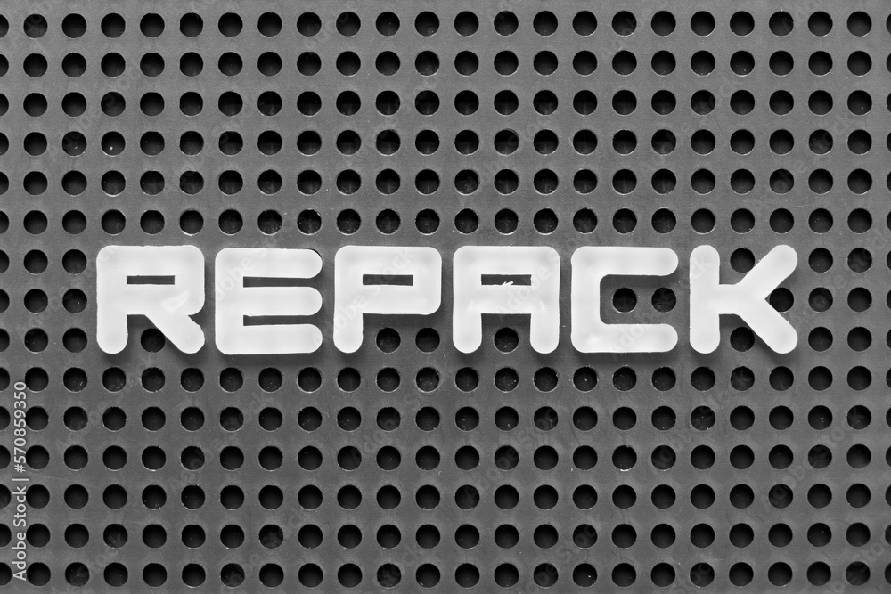 White alphabet letter in word repack on black pegboard background Stock ...