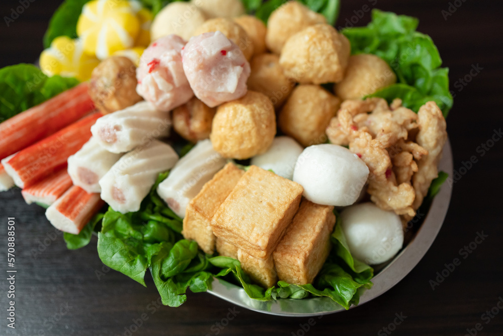 Various steamboat ready to cook ingredient that include fish ball, tofu ...