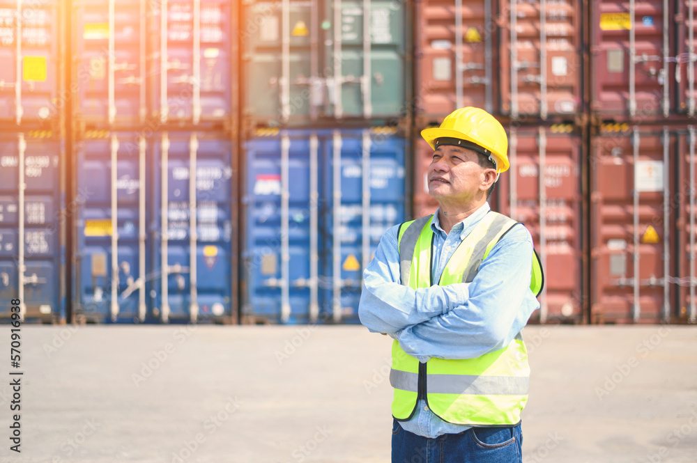 Portrait of Logistic engineer worker man standing in shipping container ...