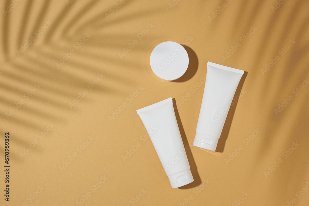 Sunscreen products concept. Flat lay photo of white cosmetic tubes ...