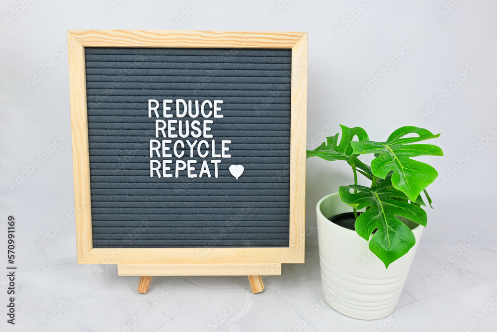 Letter board with quote Reduce Reuse Recycle, repeat and tree in basket ...