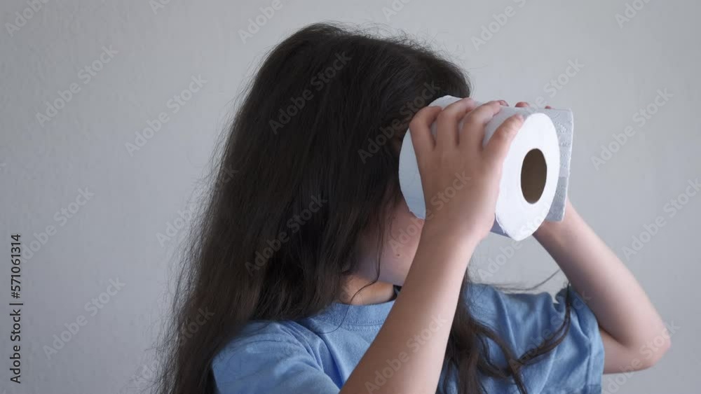 Resourceful child. Portrait of funny and pretty little girl holding ...