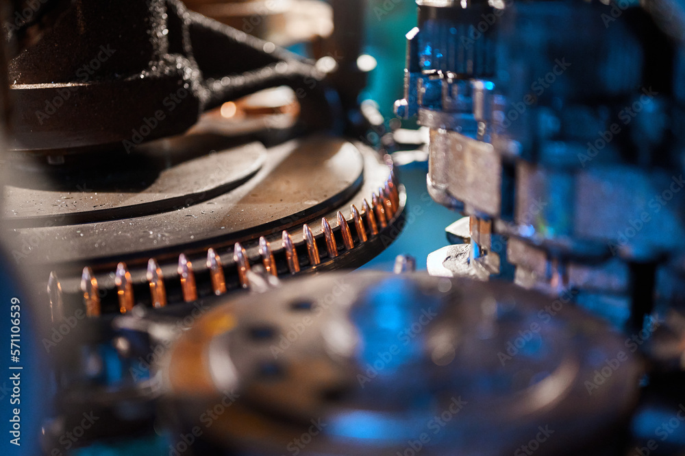 Weapon bullets in the making. The bullets are mounted in a carousel ...