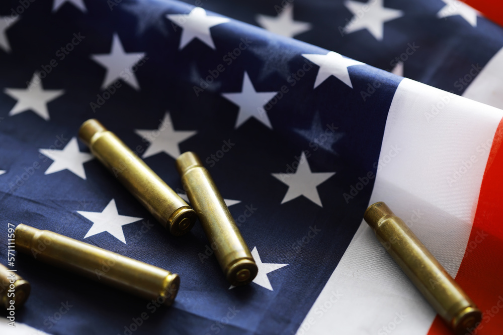 many shell casings from bullets of different caliber in the background ...