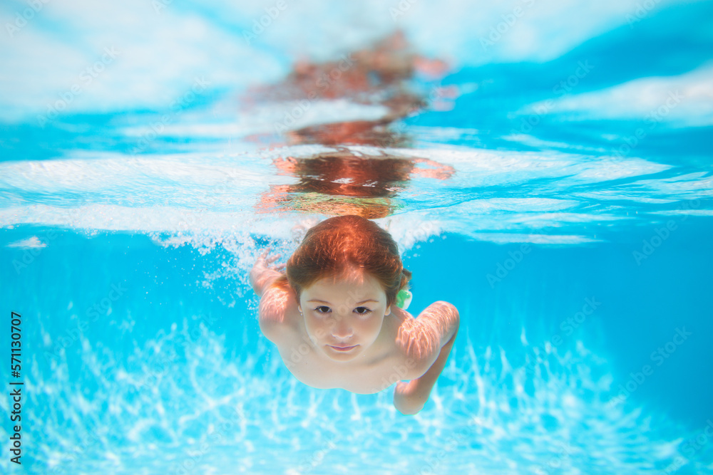 Kid boy swimming underwater on the beach on sea in summer. Blue ocean ...