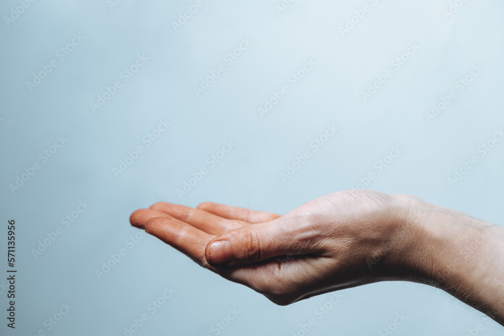 Foto de Sign need help. Alms symbol. Dirty caucasian hand isolated on a ...