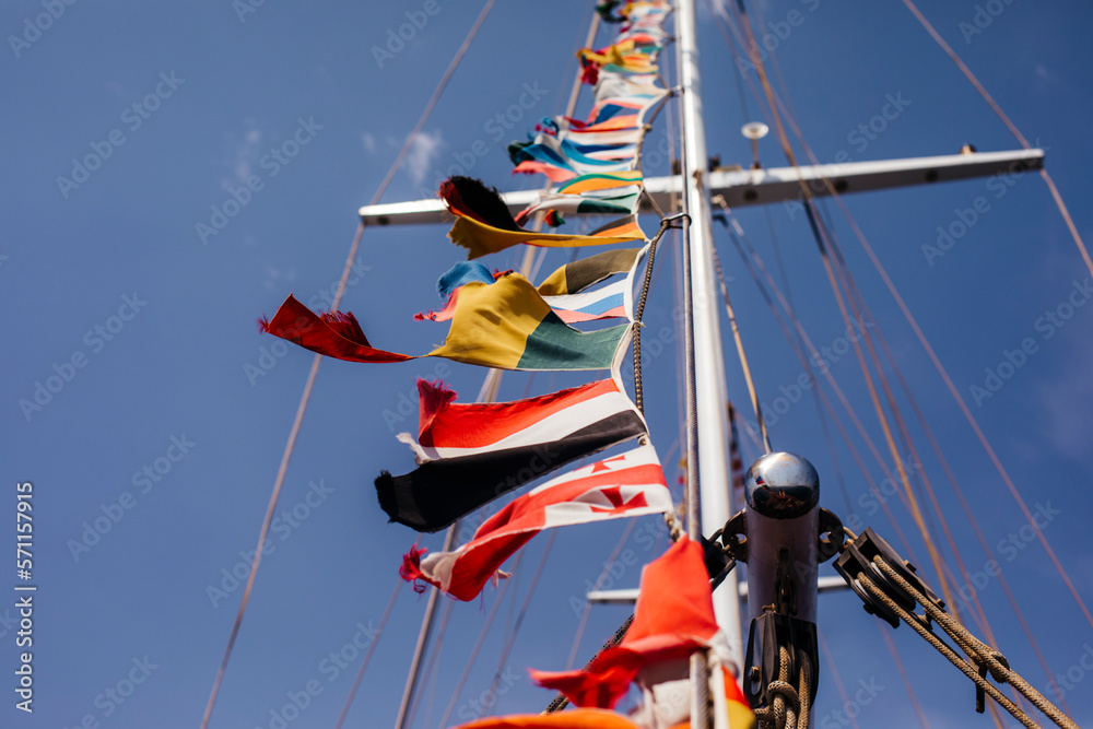 Multi colored national flags on yacht mast Stock Photo | Adobe Stock