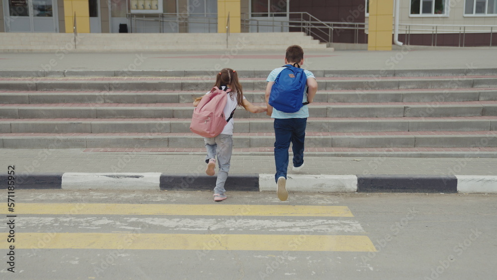 child students cross road zebra crossing. friends classmates pass car ...