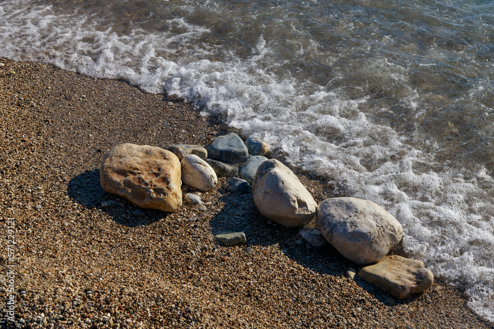Section of sea beach with some larger stones. Stock Photo | Adobe Stock