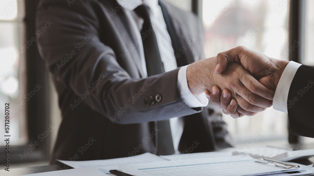Business investor group holding hands, Two businessmen are agreeing on ...