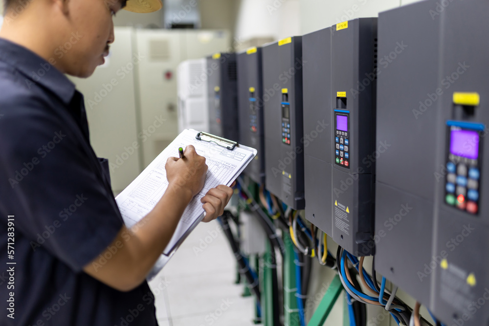 Inverter Control Room System Electrical engineers monitor the ...
