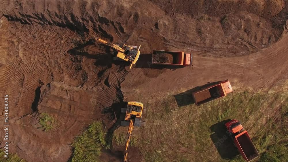 Construction excavators is working and digging at construction site ...