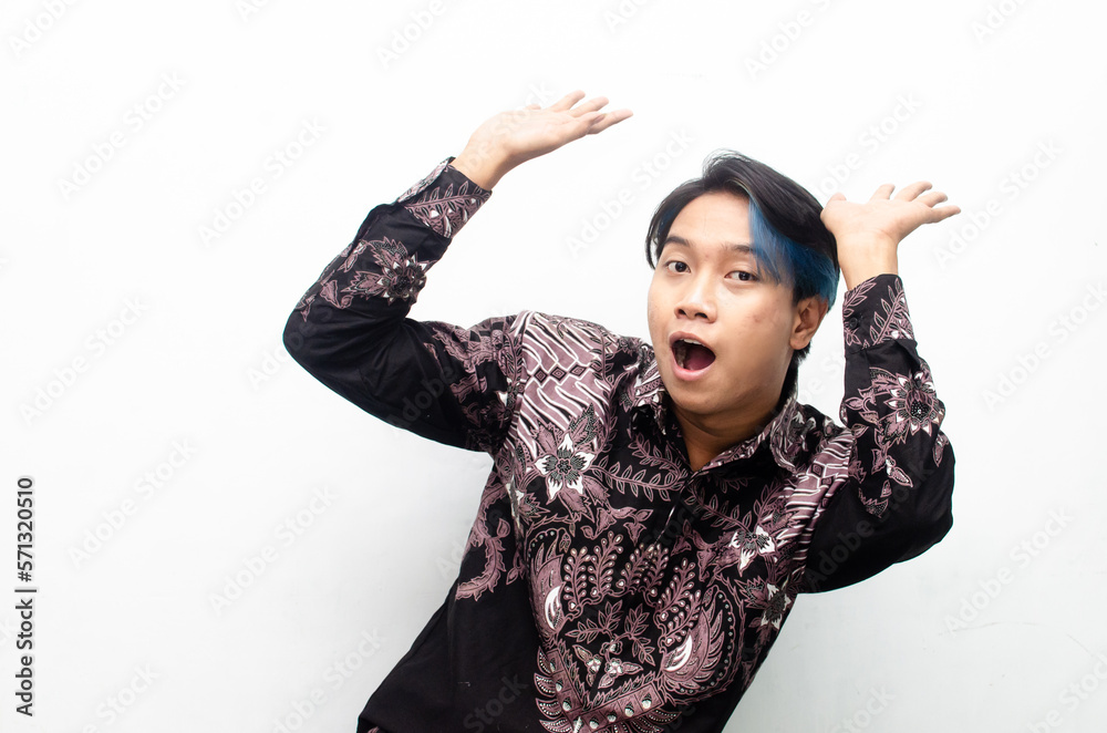 Stylish asian man with blue peek a boo hair wearing indonesian batik ...