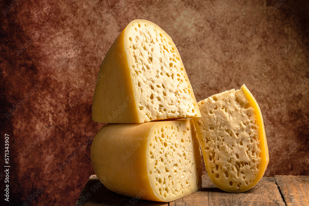 Emmental cheese triangle, Swiss cheese. piece of cheese maasdam with ...